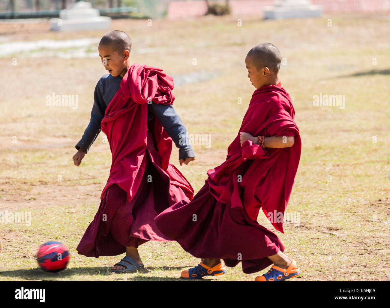 Young monks playing soccer at Chimi Lakhang (temple) near Lobesa ...