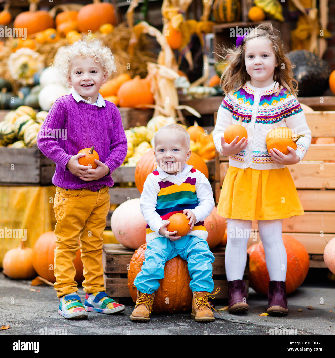 Group of little children enjoying harvest festival celebration at ...
