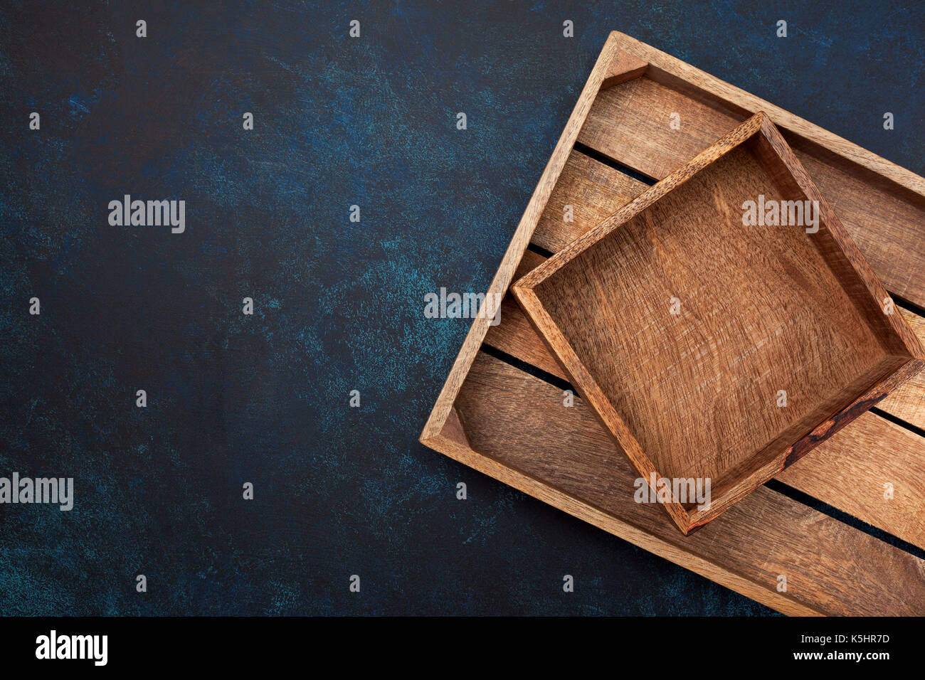 Empty wooden box on blue background. View from above. Copy space Stock ...