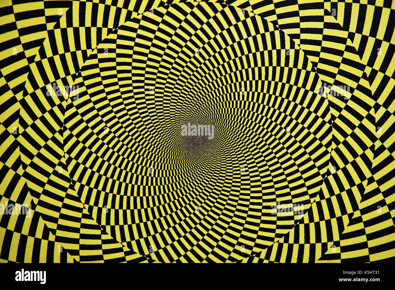 Optical illusion with circles that create the effect of rotation, as a ...