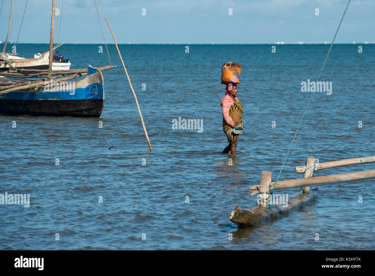 Woman carrying fish hi-res stock photography and images - Alamy