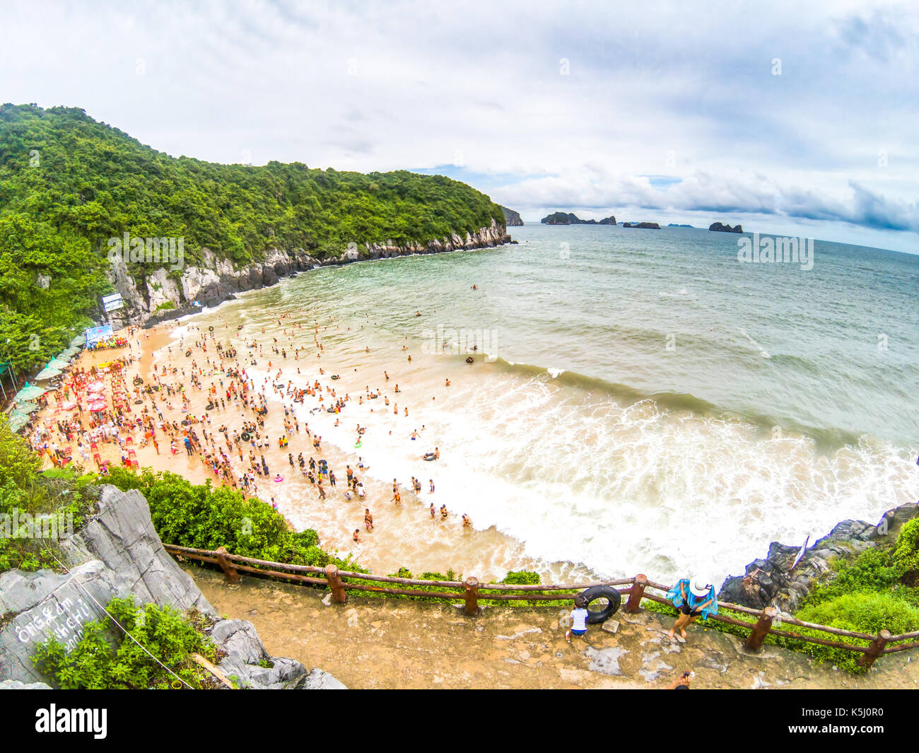 overcrowded beach in Cat Ba Island - it is a popular summer destination ...
