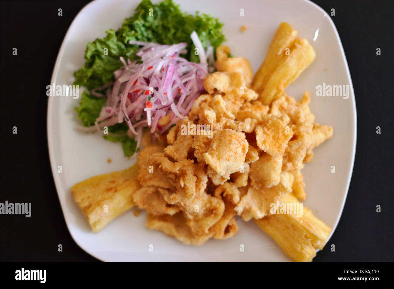Delicious dish of chicharron of pota accompanied with cassava Stock ...