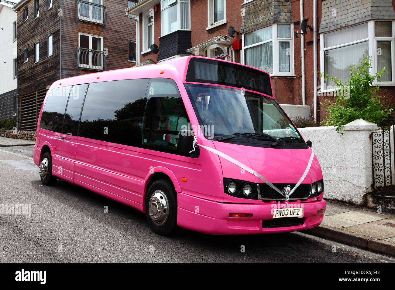 A pink party bus ready to take the bride to her wedding Stock Photo - Alamy