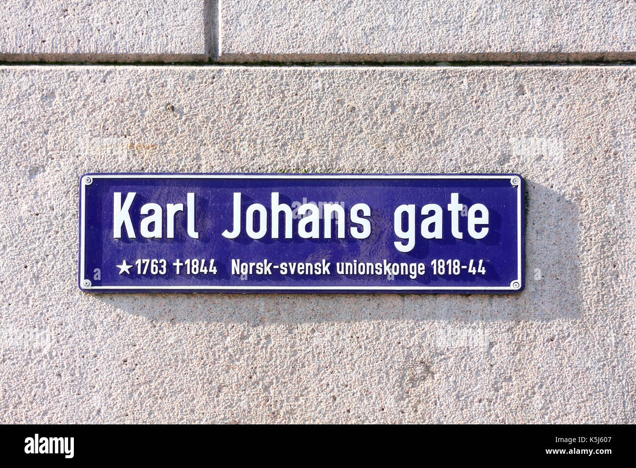 Karl Johans gate street sign on stone wall , Oslo, Norway Stock Photo ...