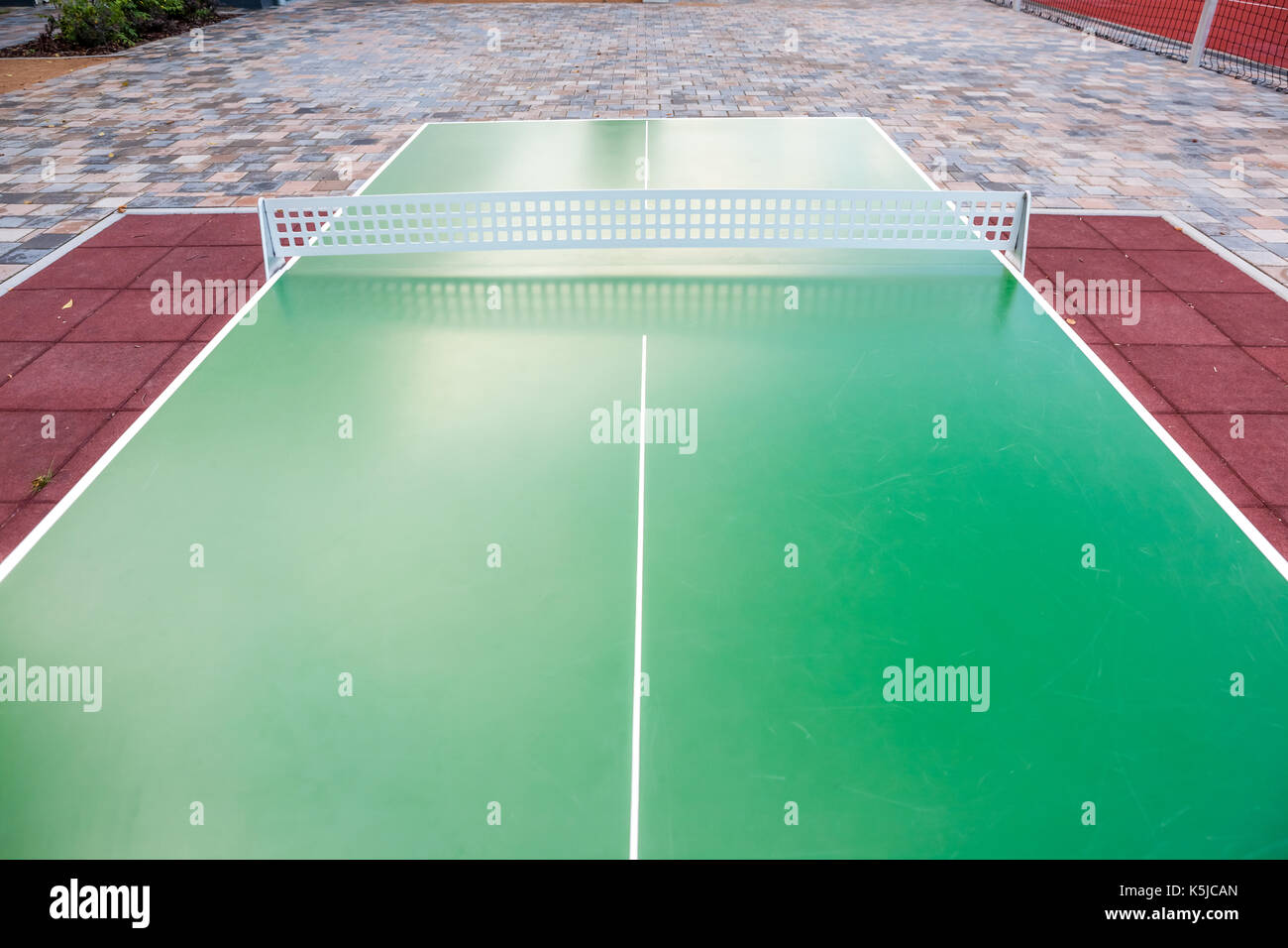 In a park there is a table tennis for ping pong to play Stock Photo - Alamy