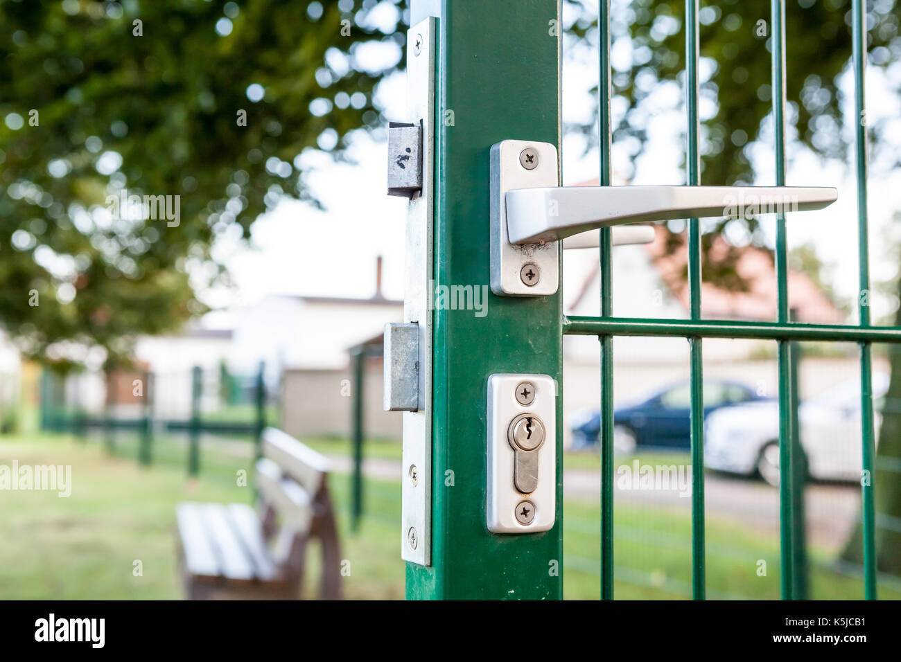 an security lock with cylinder and an handle in an iron fences Stock ...