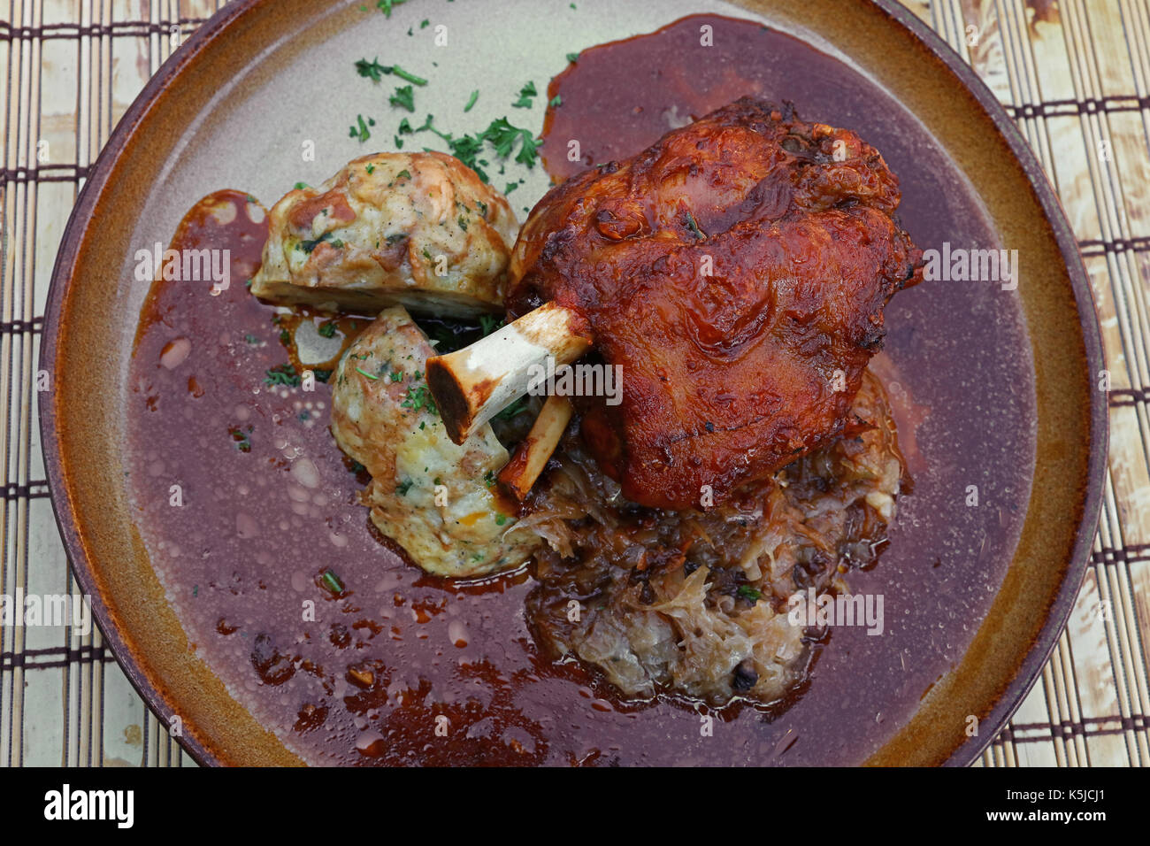 Big portion of roasted succulent pork fore shank or knuckle with ...