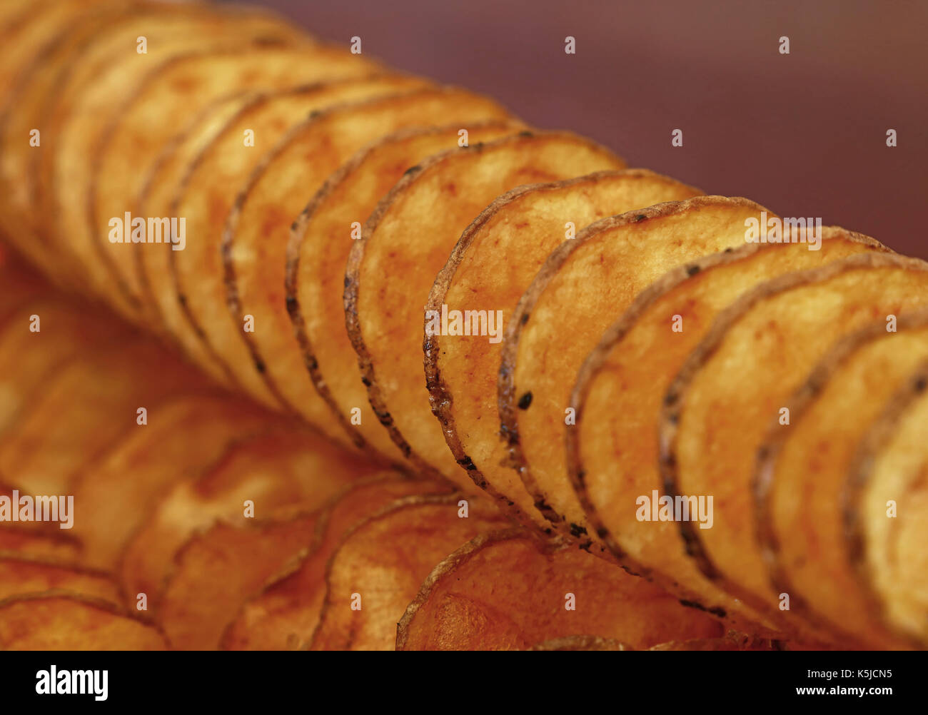 Natural round fried potato chips with skin close up, low angle view ...