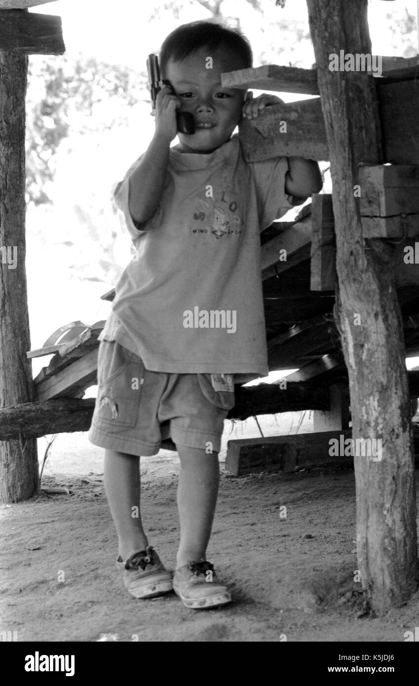 A young, Burmese boy plays with a toy gun at a Thai Medècins Sans ...
