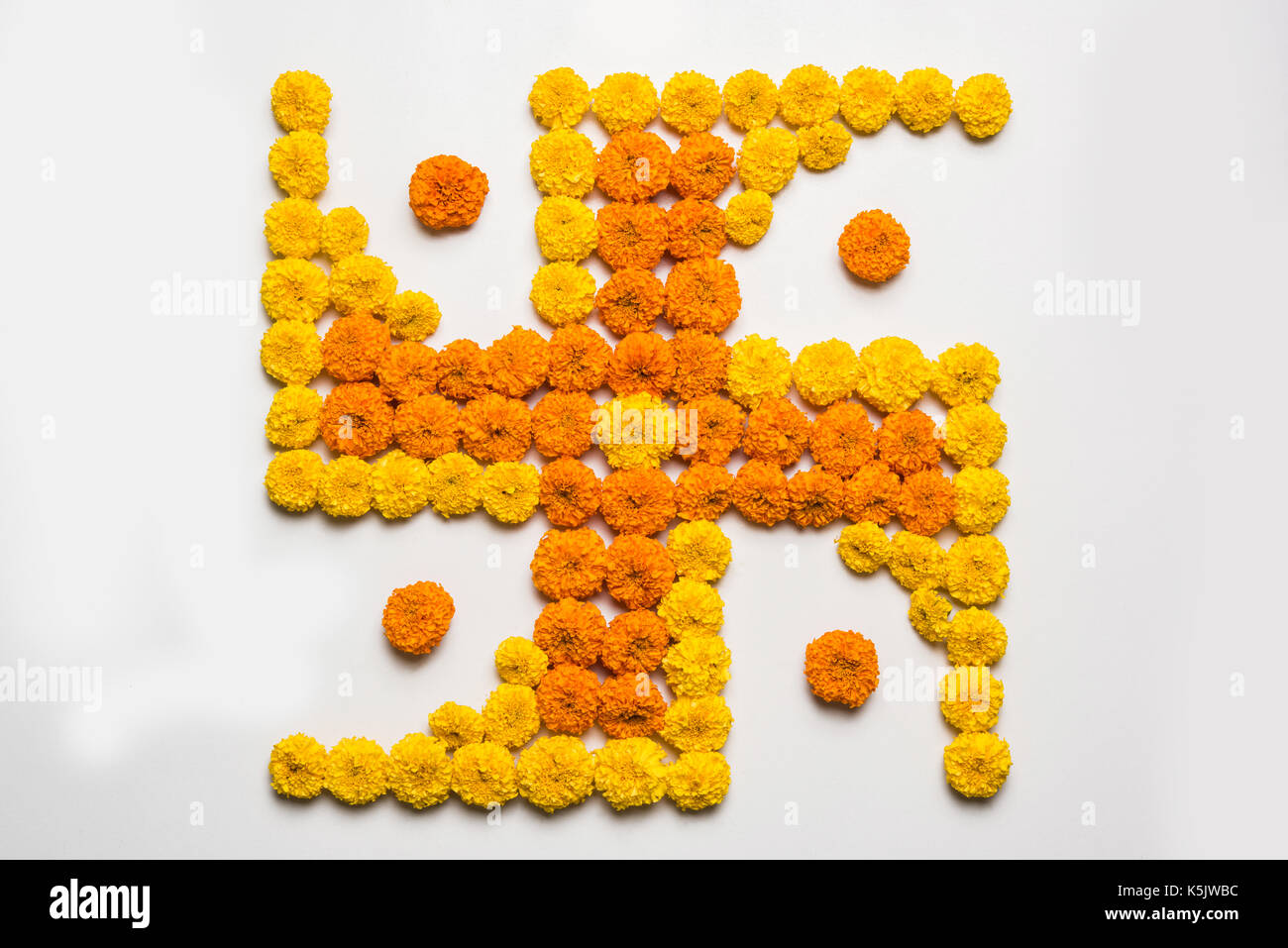 stock photo of hindu auspicious symbol called Swastika made using ...