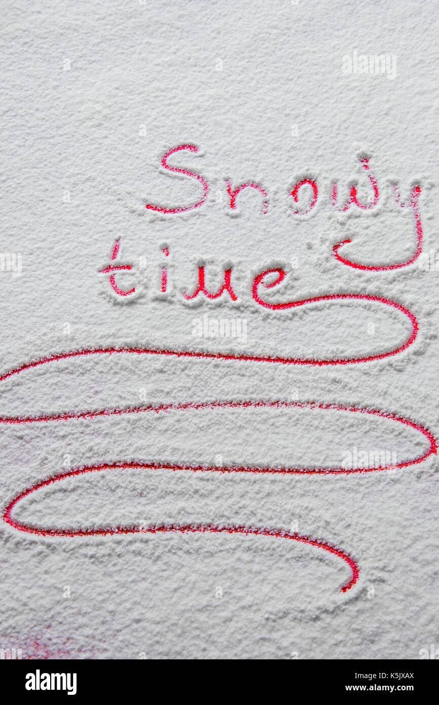 Handwritten text "Snowy time" on the snow Stock Photo - Alamy