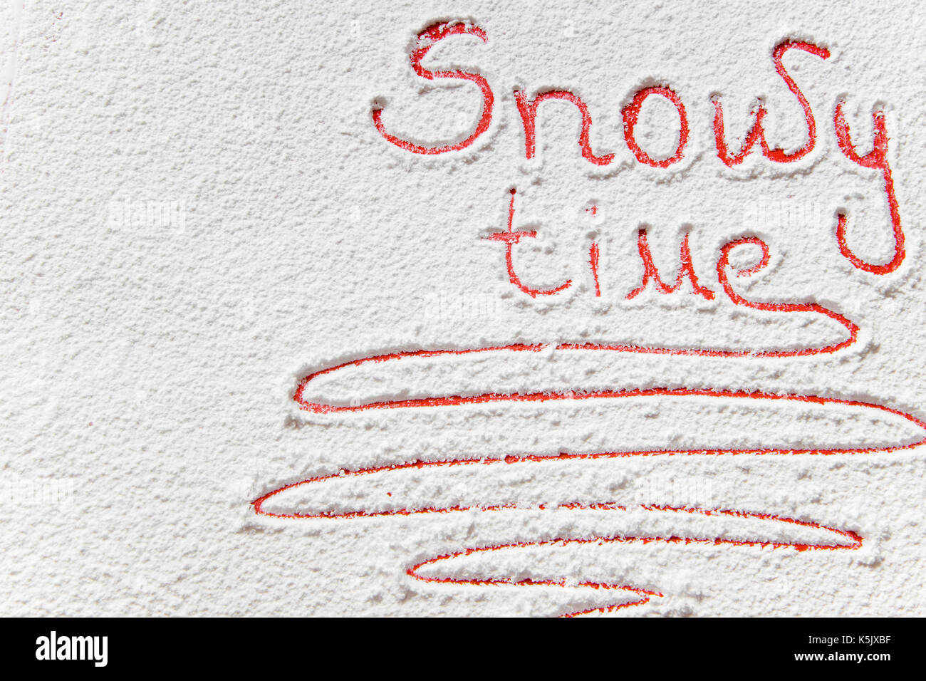 Handwritten text "Snowy time" on the snow Stock Photo - Alamy