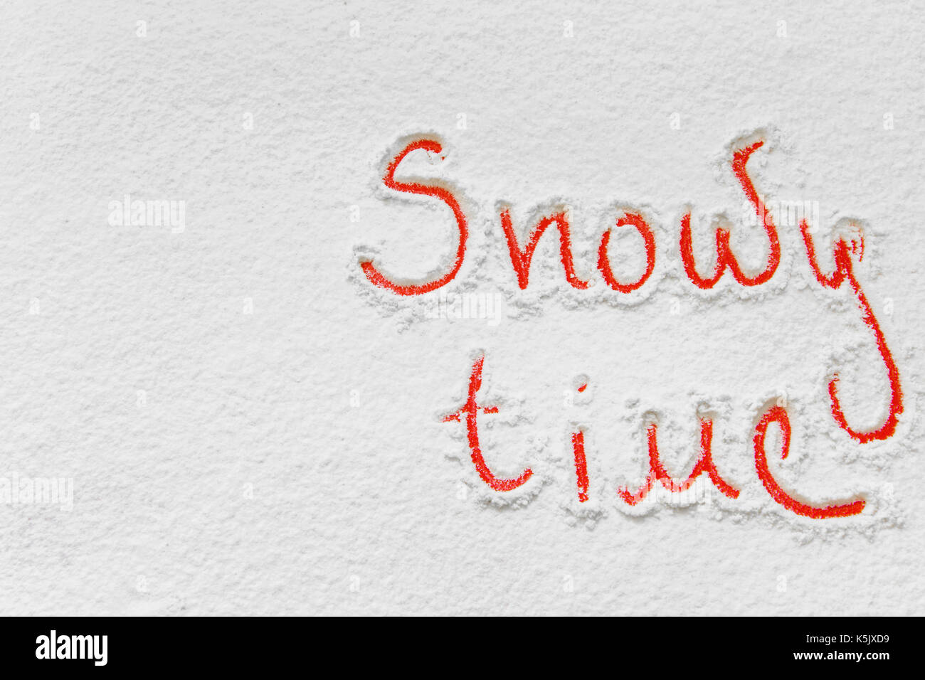 Handwritten text "Snowy time" on the snow Stock Photo - Alamy