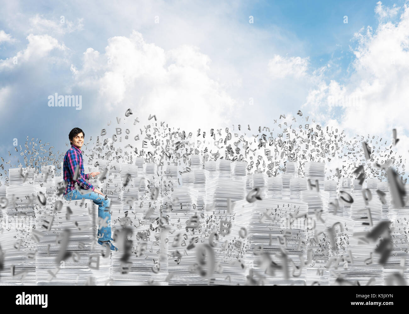 Attractive man sitting on pile of paper documents Stock Photo - Alamy