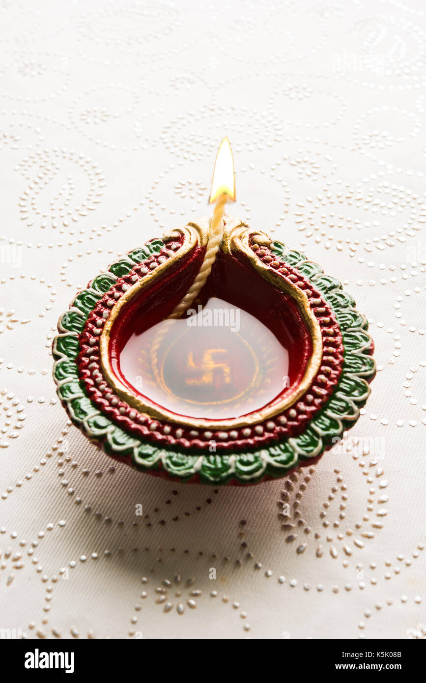 stock photo of beautiful diwali diya, isolated over decorative ...