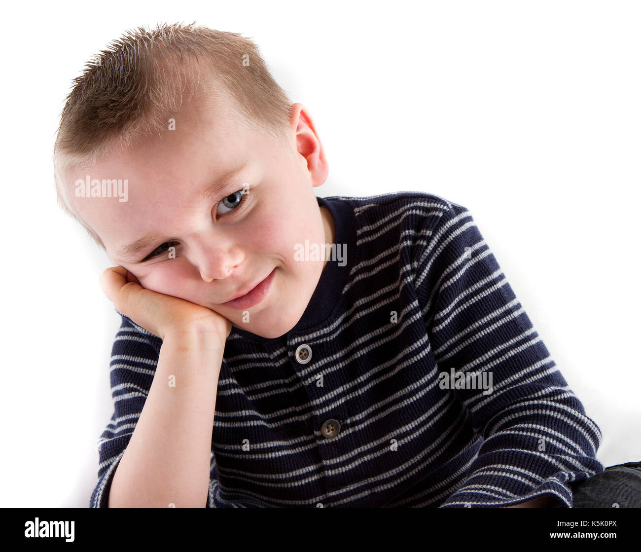 Boy trying not to fall asleep Stock Photo - Alamy