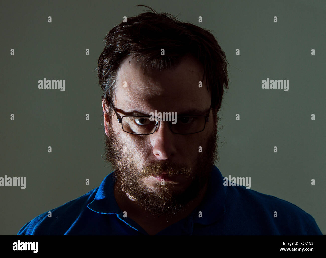 man looking at camera with dramatic lighting and an angry face Stock ...