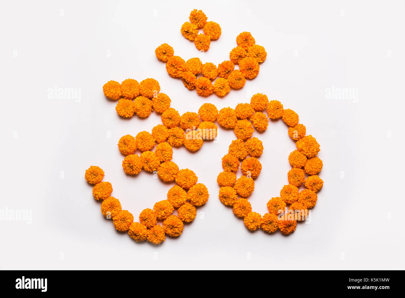 Stock photo of word Aum or om made using marigold flower arrangement ...