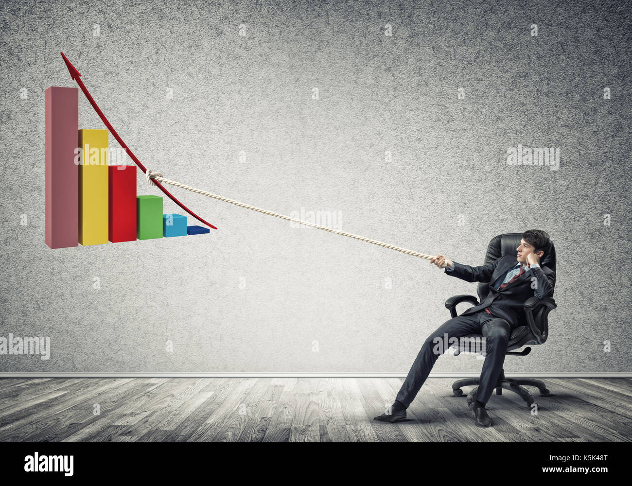 Businessman pulling graph with rope as concept of power and control ...