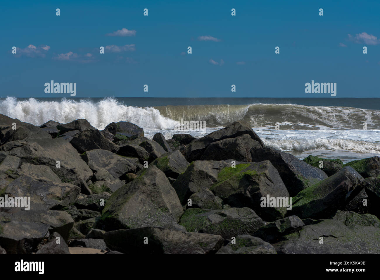 Waves from the Atlantic Ocean roar onto the beaches and jetties of ...