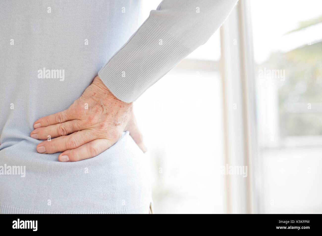 Sore back hi-res stock photography and images - Alamy