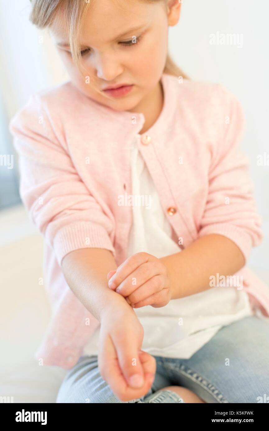 Girl scratching arm hi-res stock photography and images - Alamy