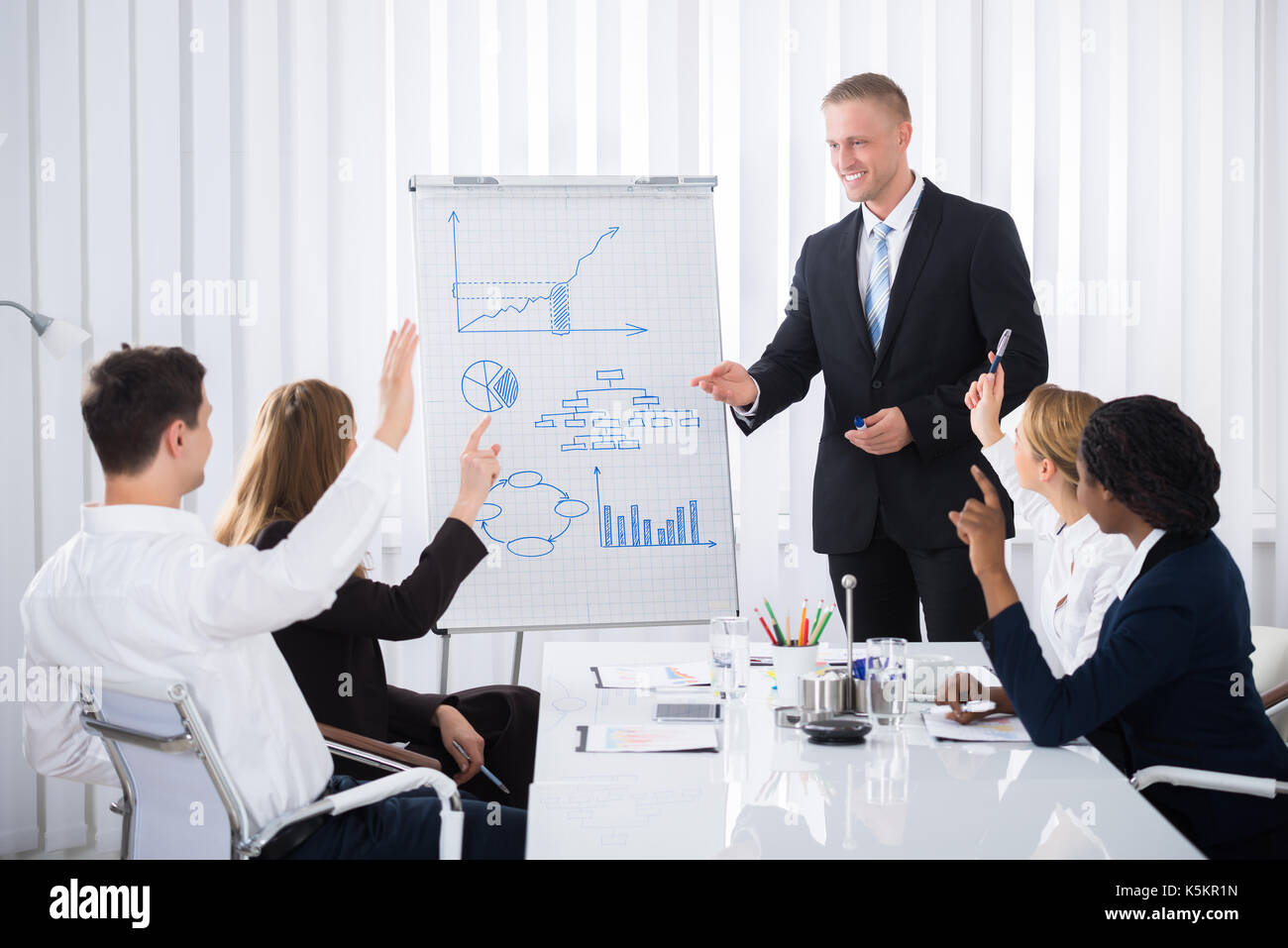 Vote raising hands hi-res stock photography and images - Alamy