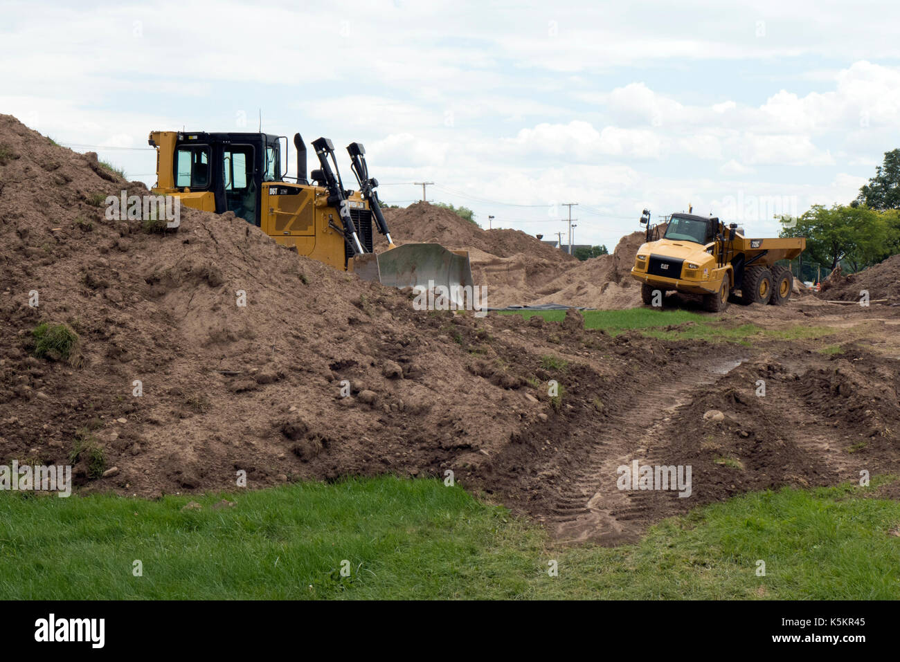 Earth moving with heavy equipment Stock Photo - Alamy