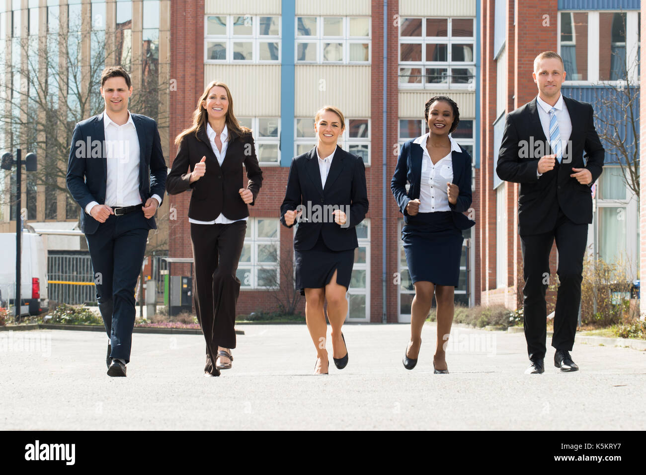 Professional people running hi-res stock photography and images - Alamy