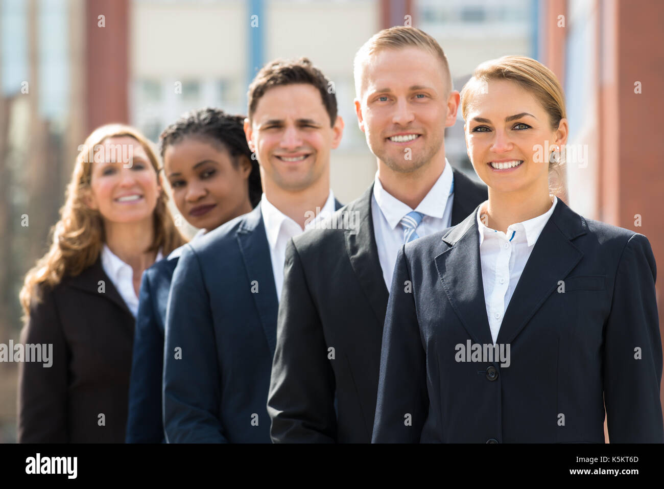 People standing queue hi-res stock photography and images - Alamy