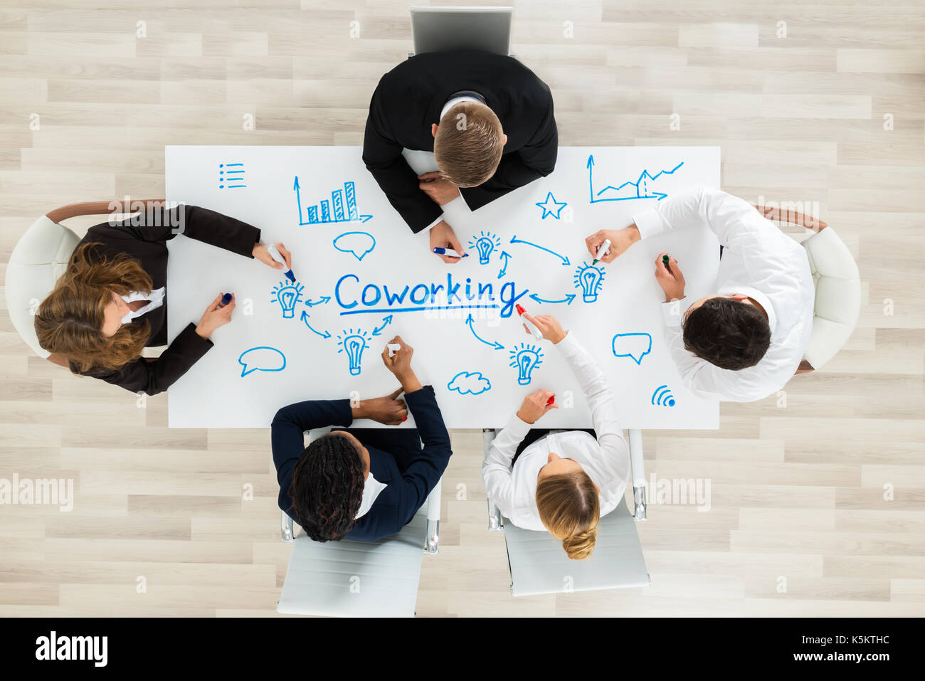 Group Of Businesspeople Together In CoWorking Space Stock Photo - Alamy