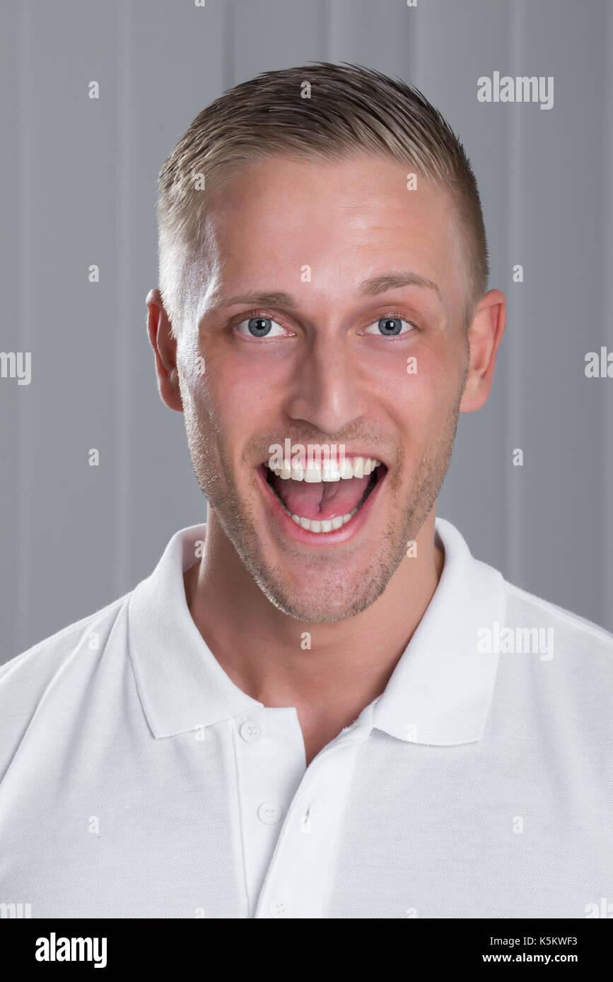 Portrait Photo Of Young Handsome Man Laughing Stock Photo - Alamy