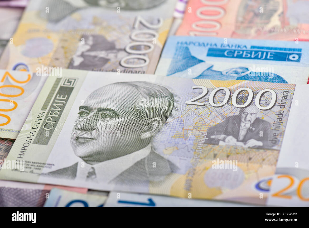 Banknote of 2000 Serbian dinars (RSD) and pile of different bills Stock ...