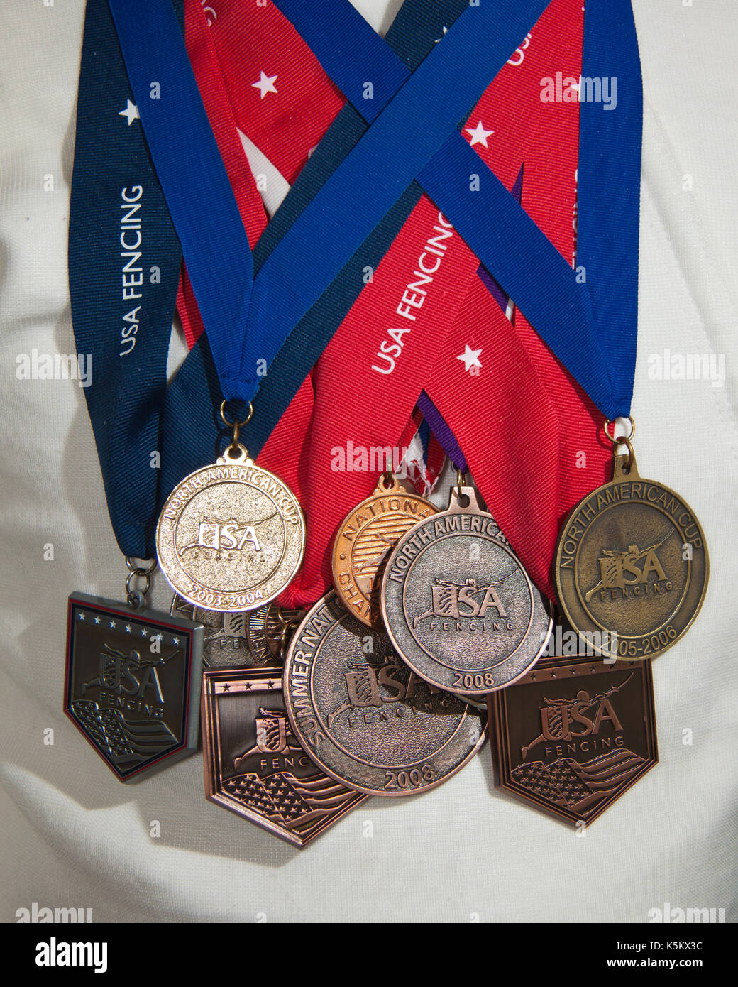 Fencing champion shows off chest full of medals he has won Stock Photo ...