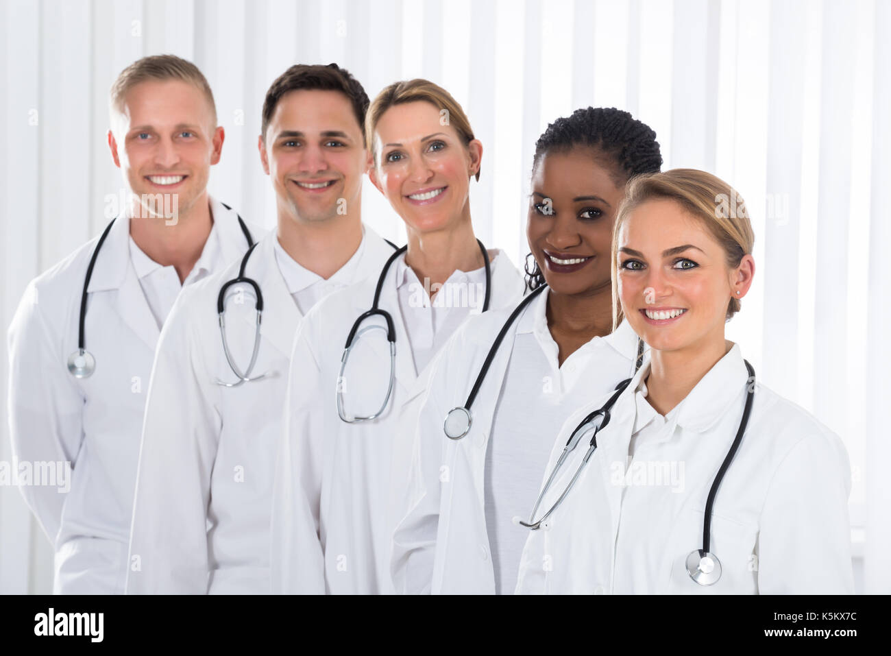 Diverse medical group standing in hi-res stock photography and images ...