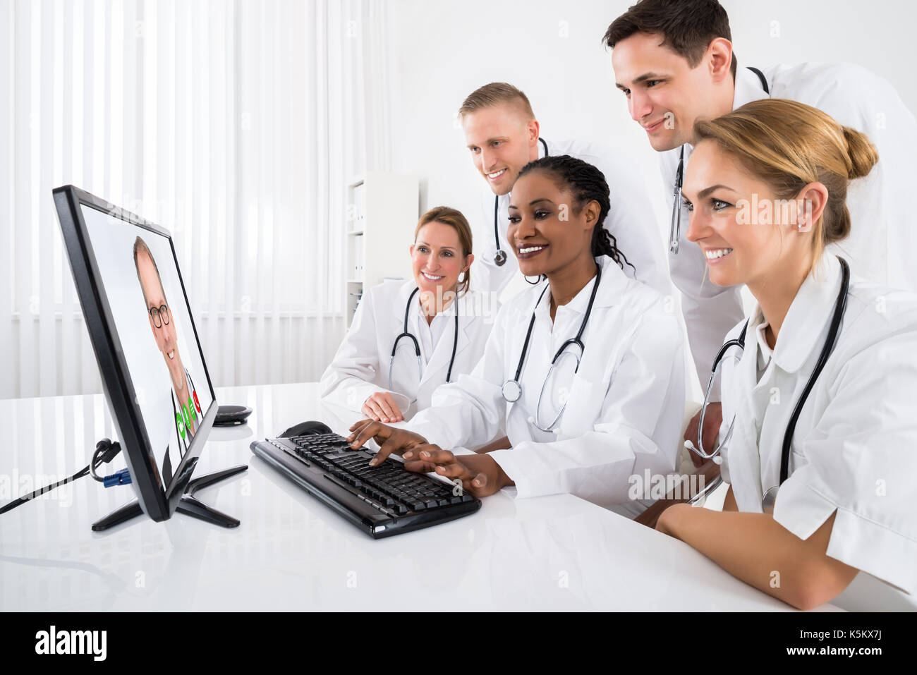 African doctors looking at computer hi-res stock photography and images ...