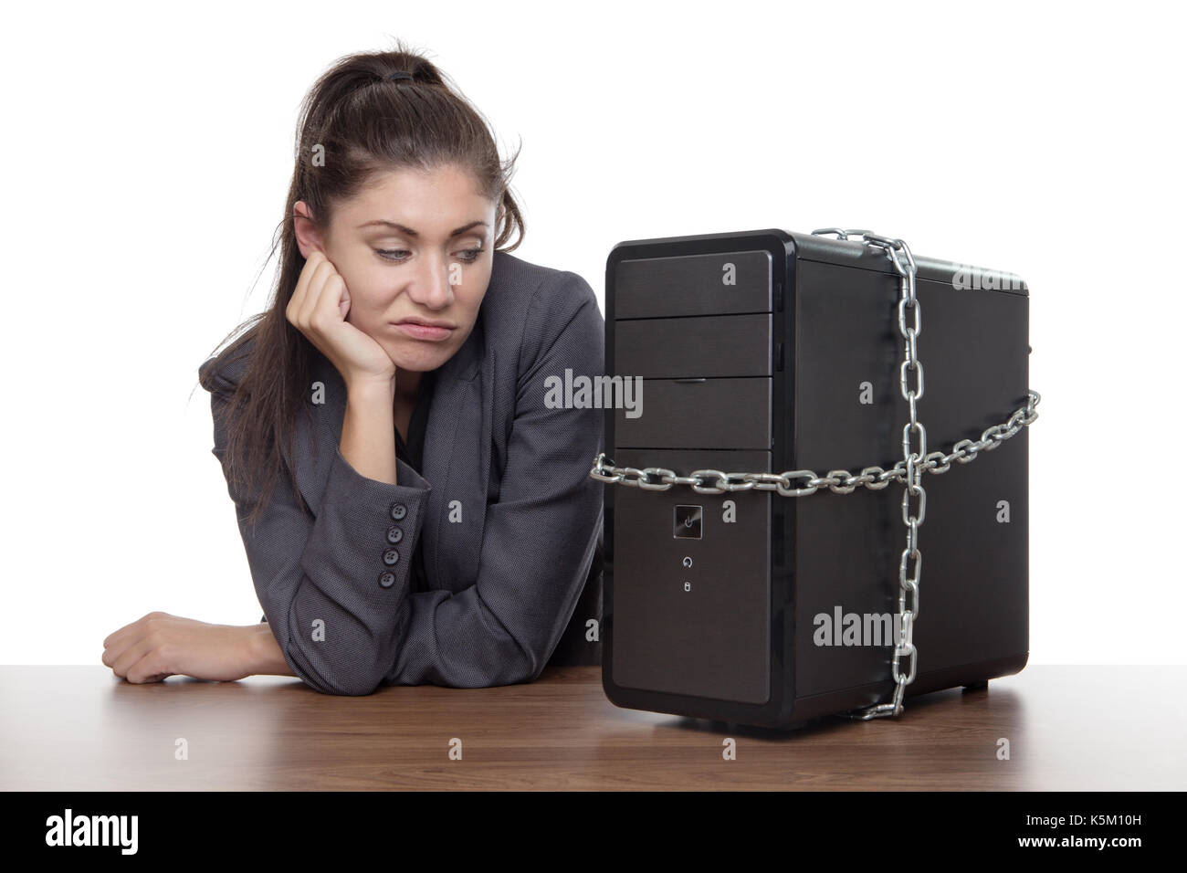 Computer locked up and business woman not looking very happy unsure ...