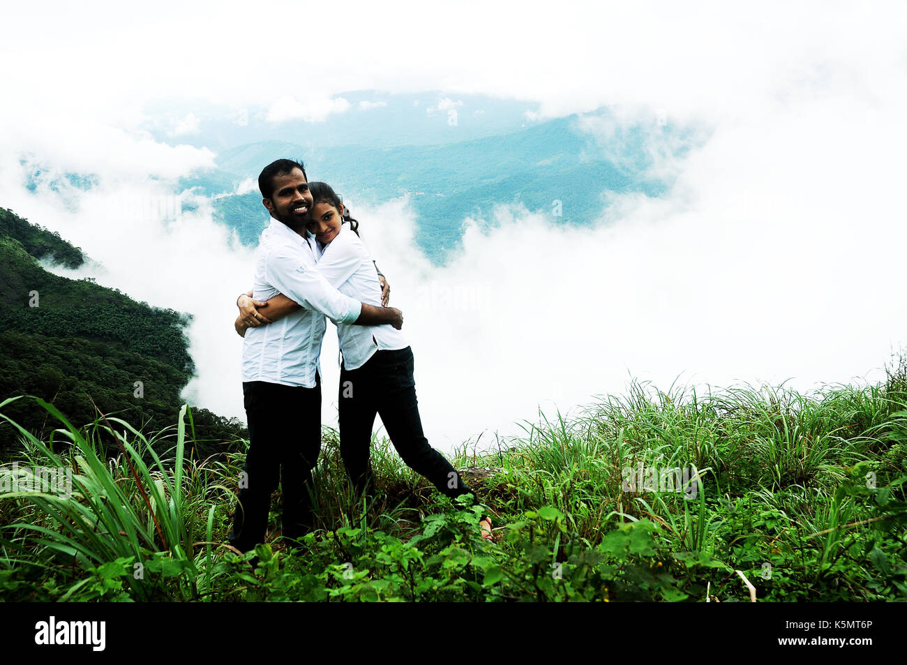 Hugging couple in high mountains, couple hugging in beautiful mountains ...