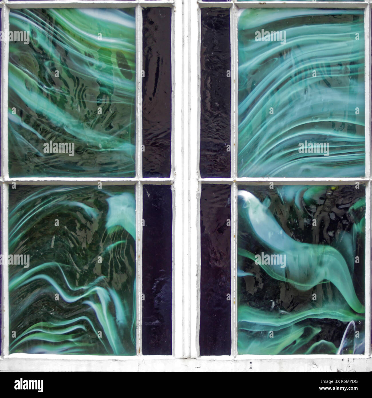 spooky green Halloween multicolored glass window of the goma Stock ...