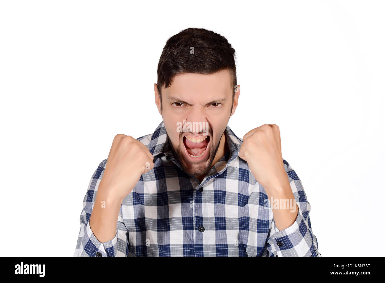 Portrait of a young latin man celebration victory. Isolated white ...