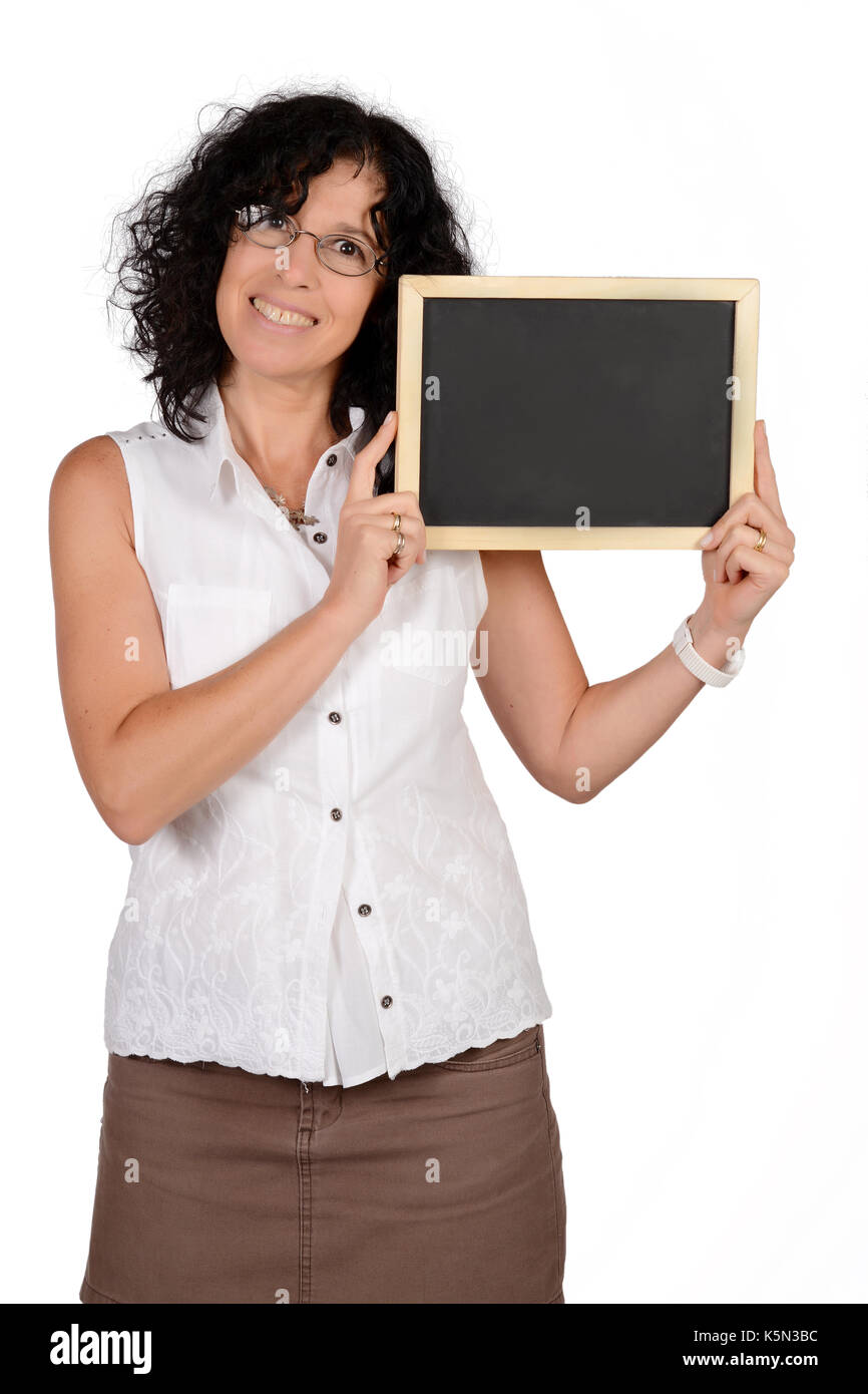 Portrait of beautiful school teacher holding an empty chalkboard ...