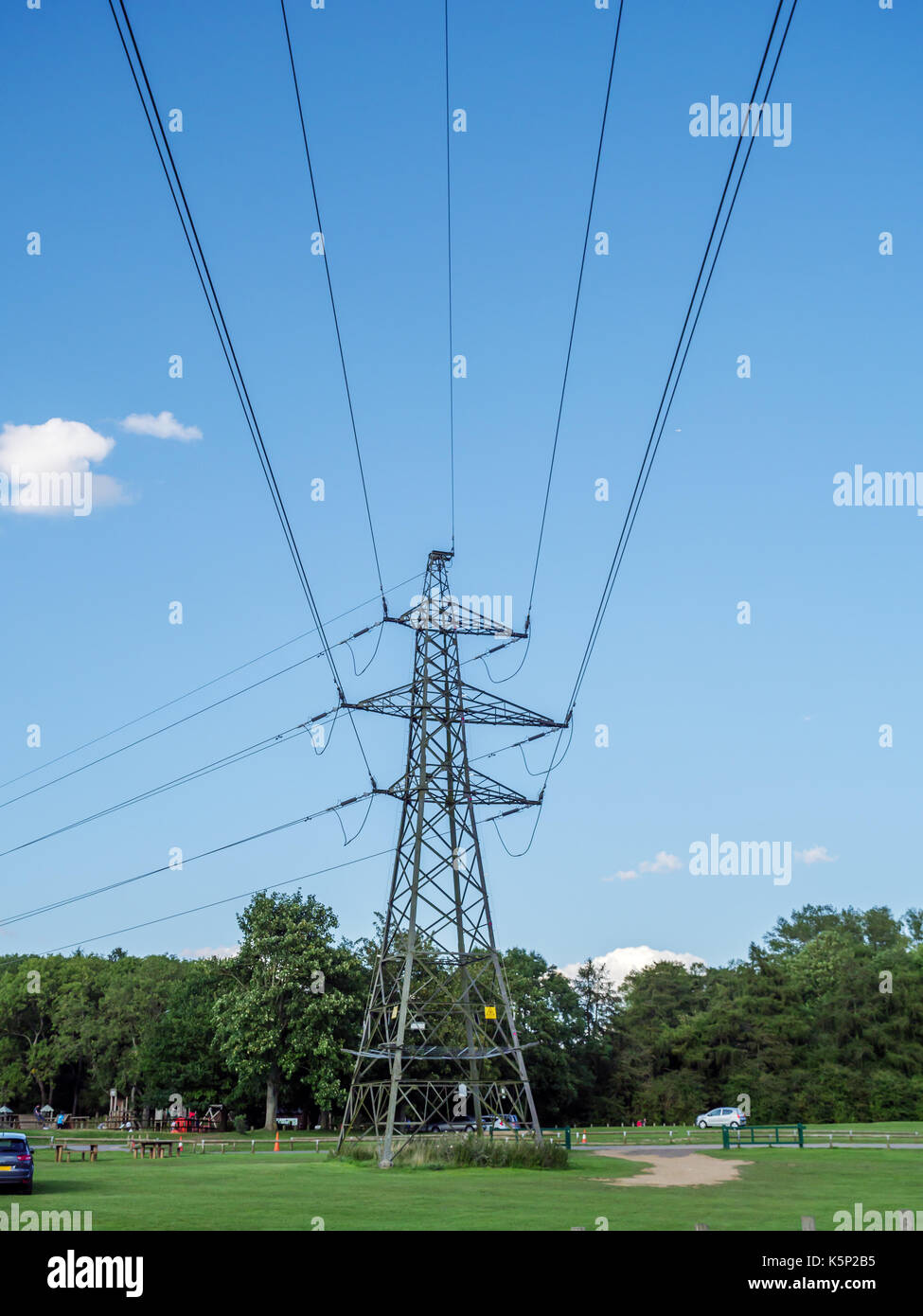 Electric wire electric tower on clear sky background Stock Photo - Alamy
