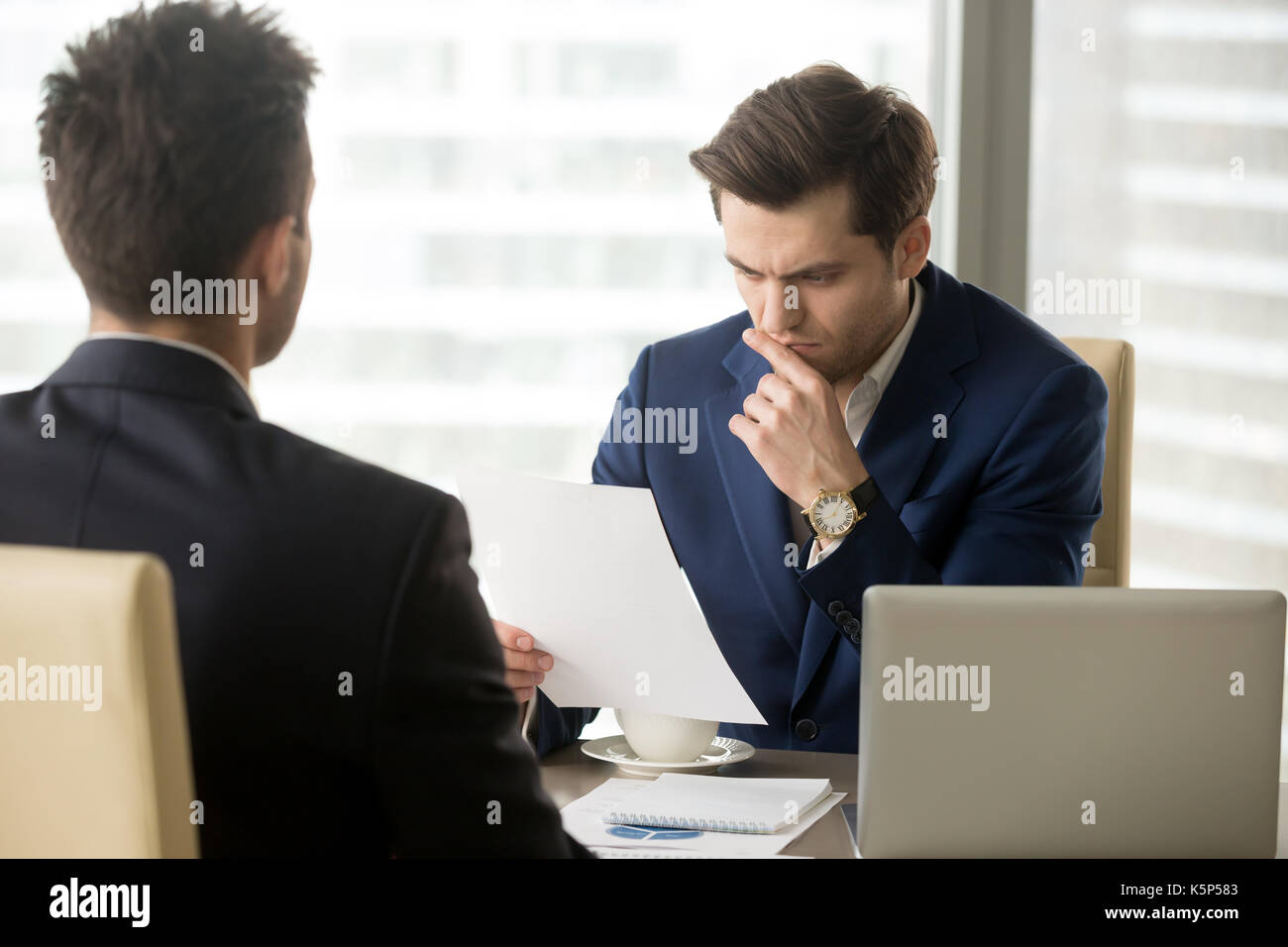 Boss worrying because of company bad annual report Stock Photo - Alamy