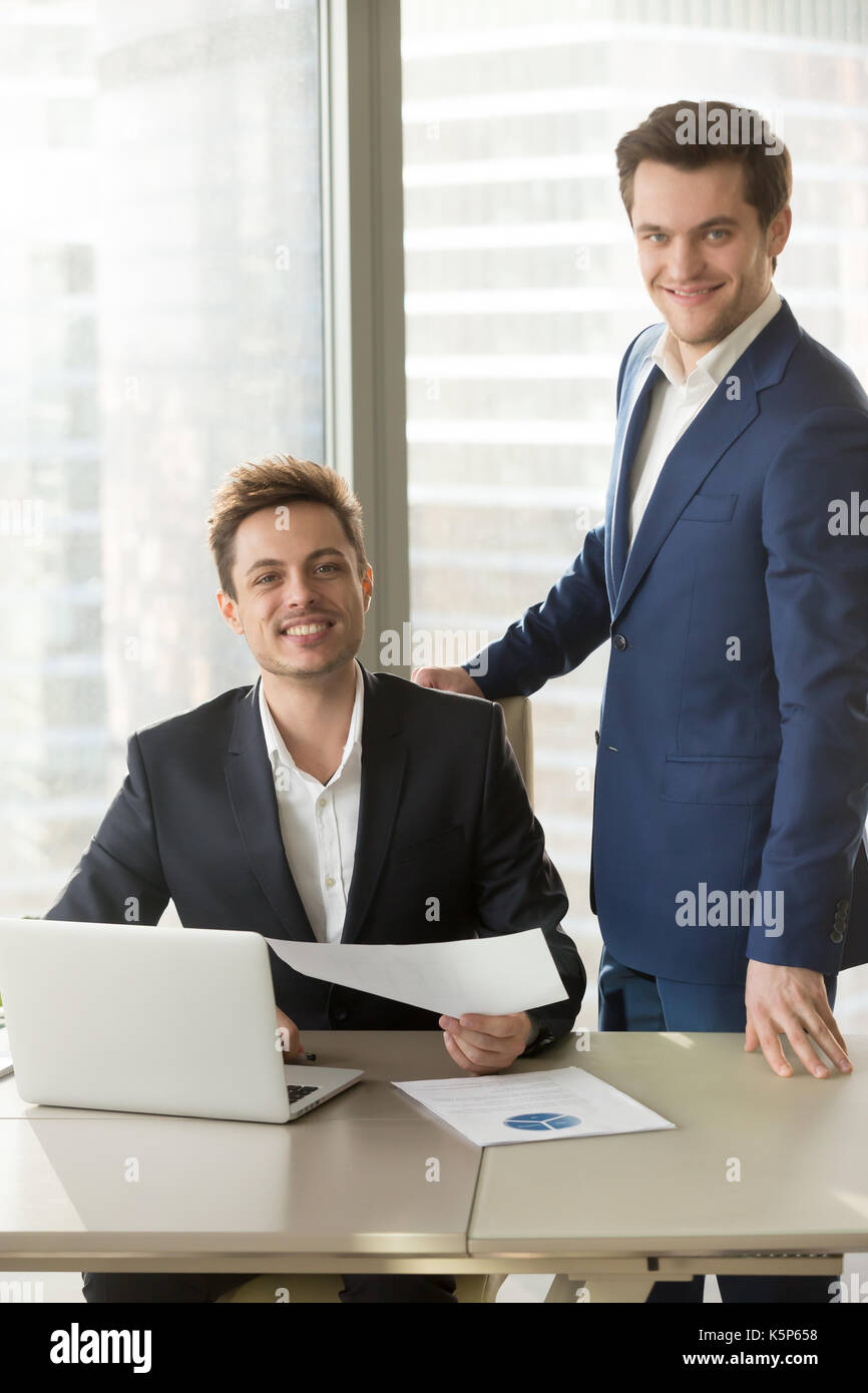 Happy smiling colleagues posing together in office Stock Photo - Alamy