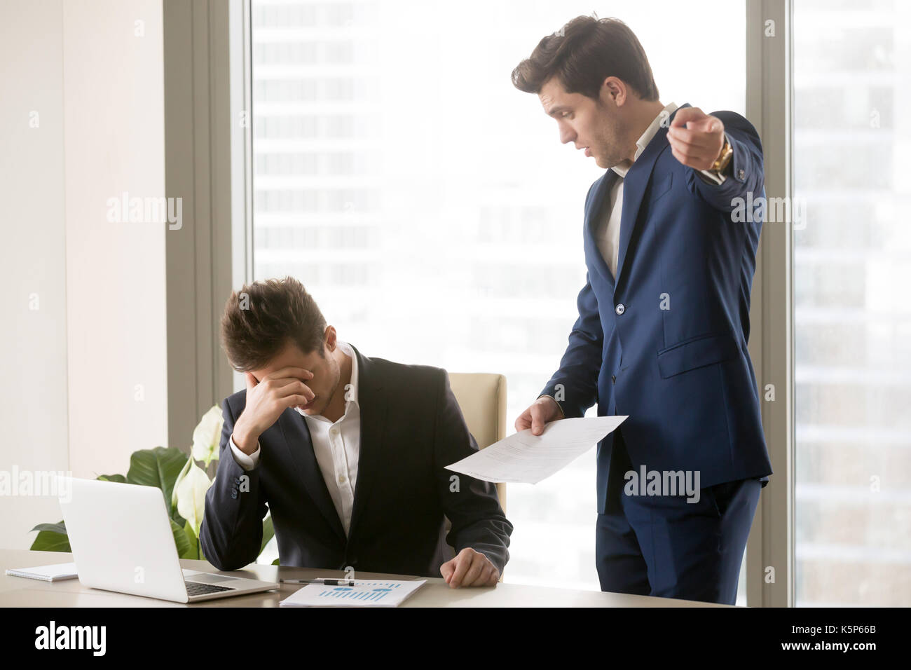 Dissatisfied annoyed boss arguing with employee Stock Photo - Alamy