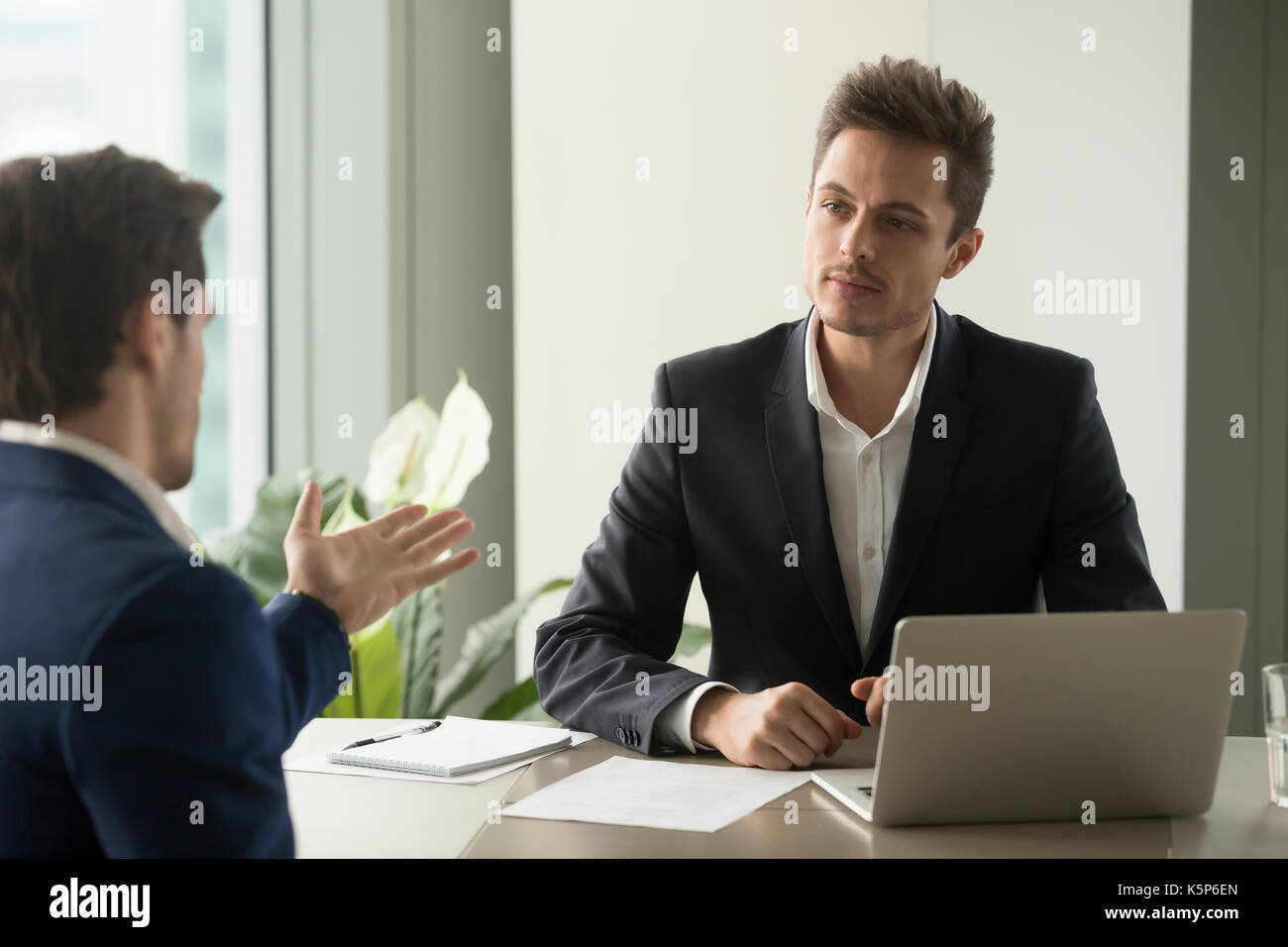 Focused positive business partners meeting hi-res stock photography and ...