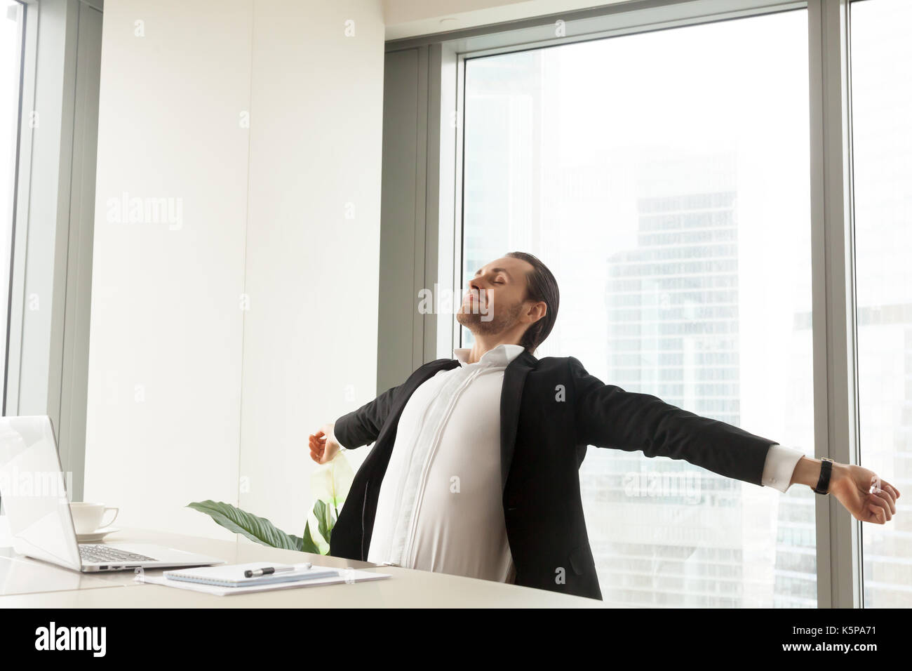 Businessman stretching office hi-res stock photography and images - Alamy