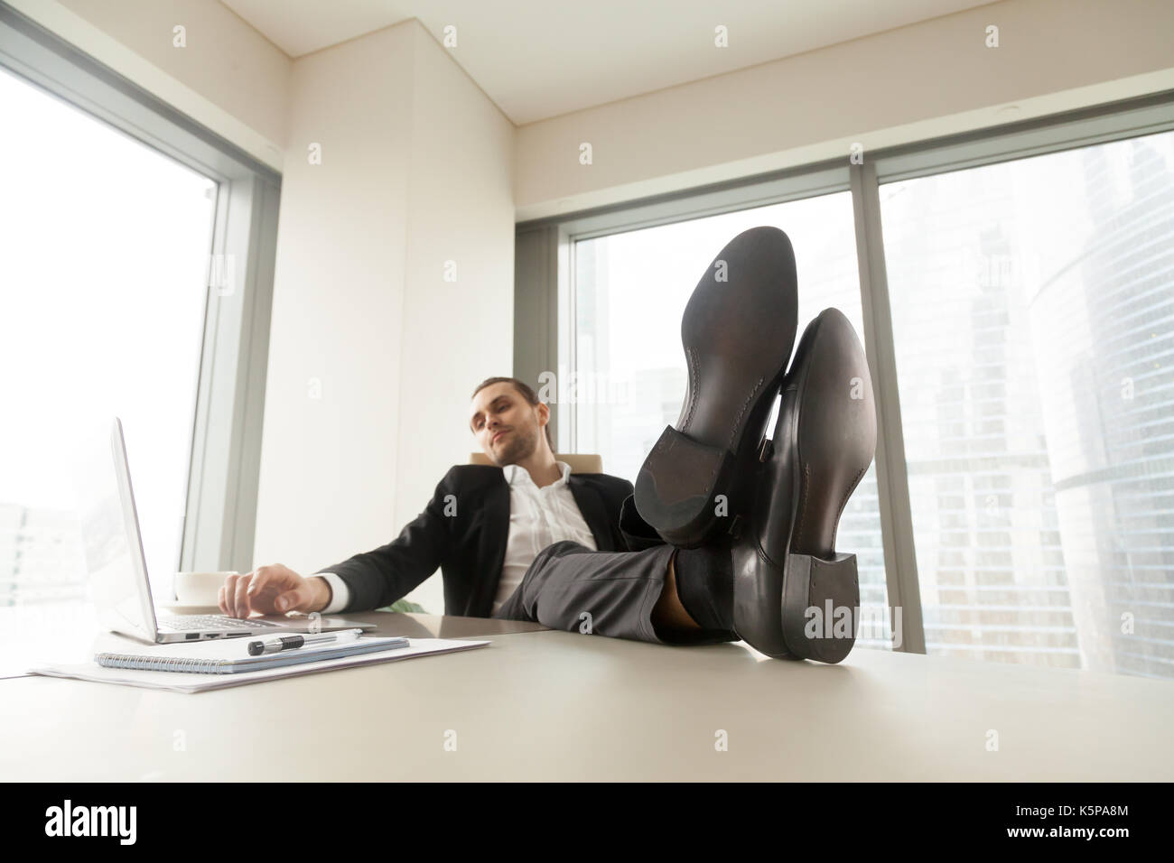 Business man relaxing desk boss hi-res stock photography and images - Alamy