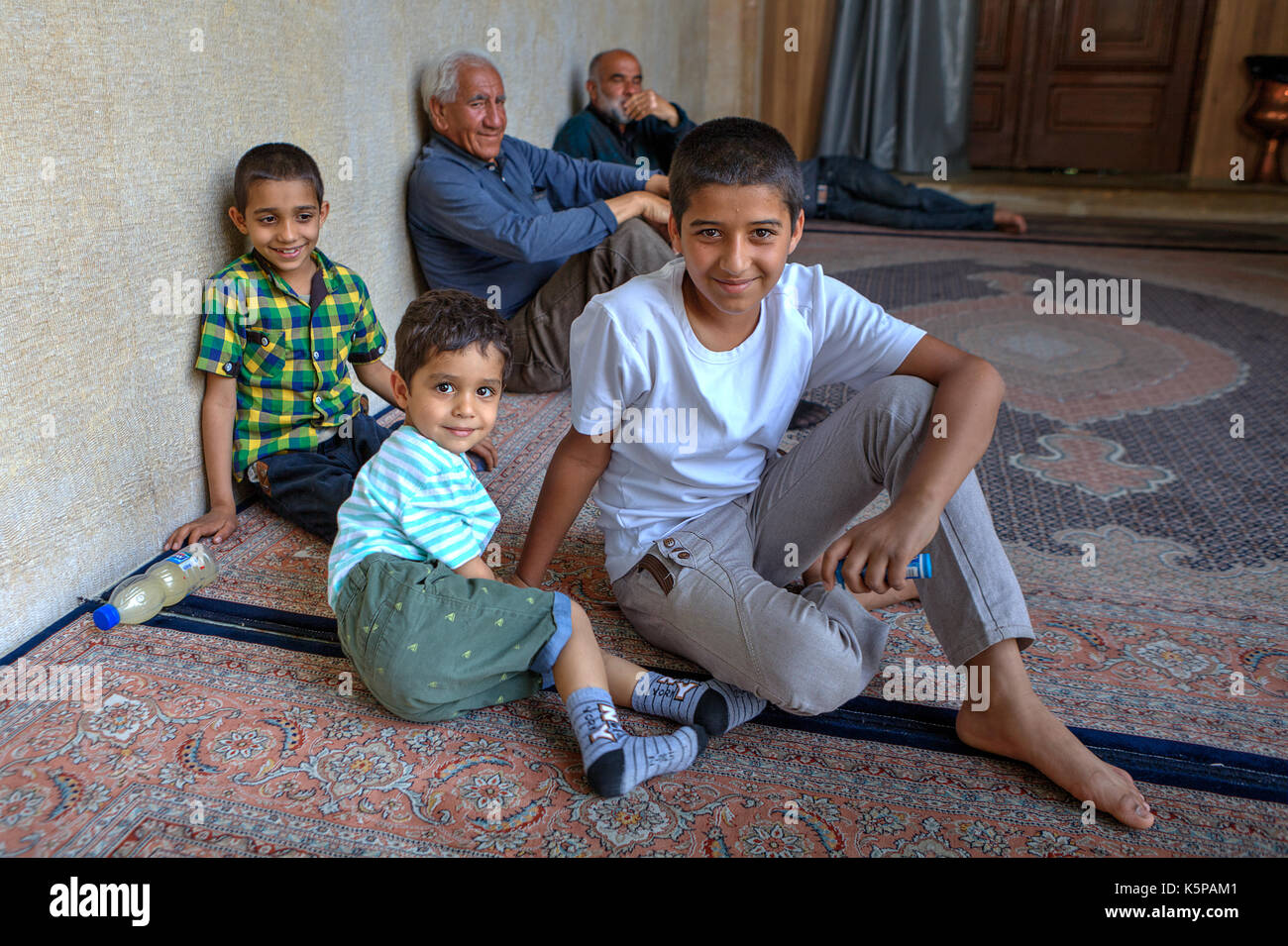 Iran mosque people smile hi-res stock photography and images - Alamy